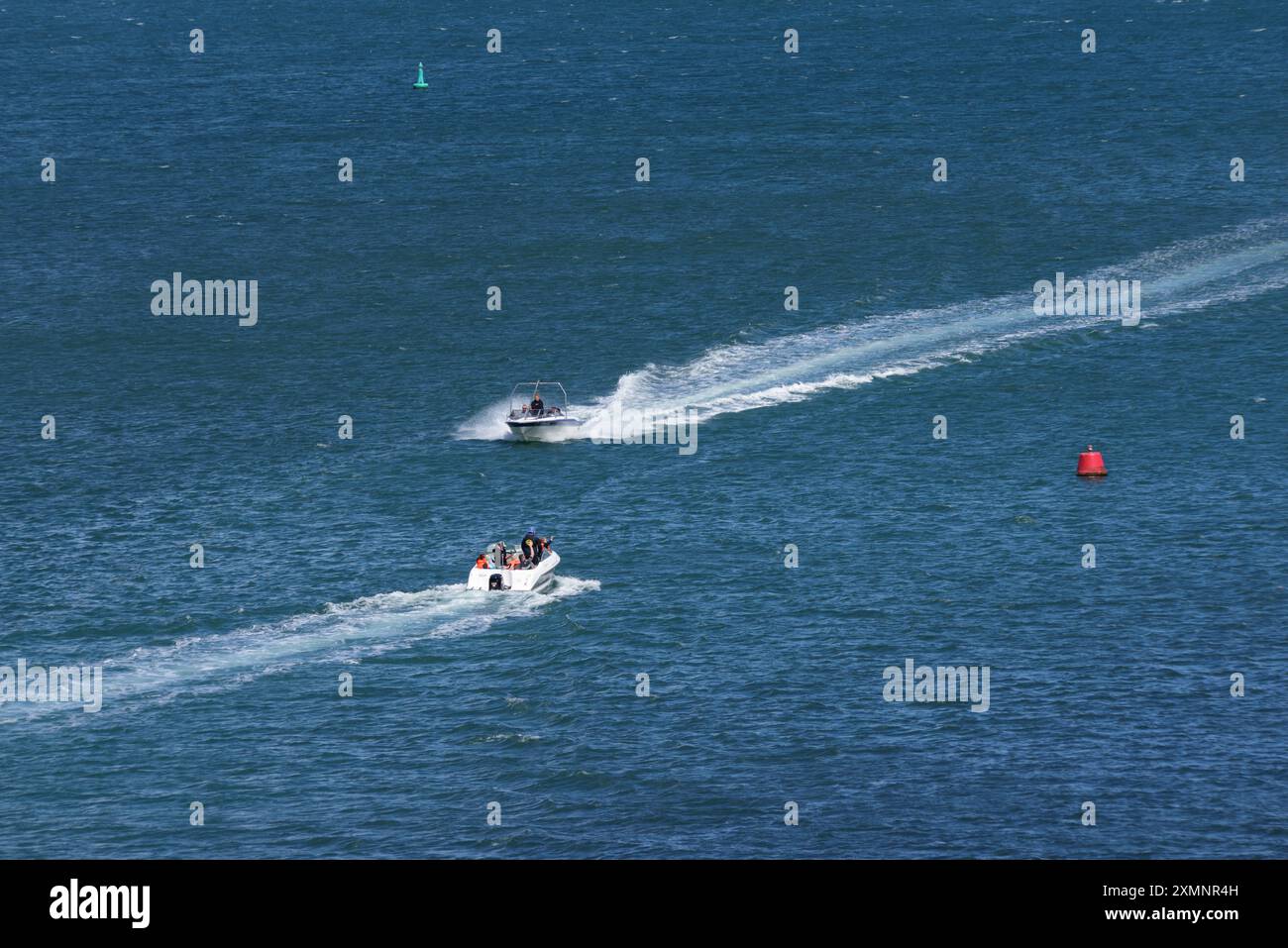 Boats passing each other in open water on Teignmouth seafront Stock ...