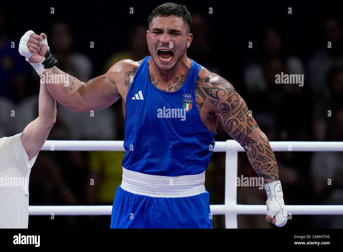 Italy's Diego Lenzi celebrates after defeating United States' Joshua ...