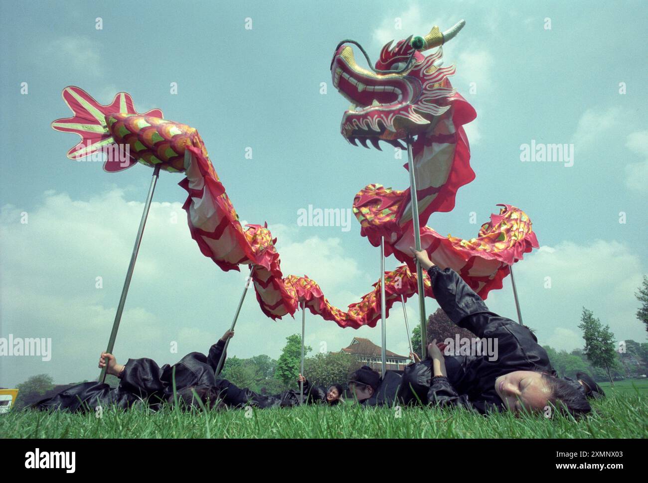 Chinese girl acrobats relax with their Symbolic Totom Dragon in Preston ...
