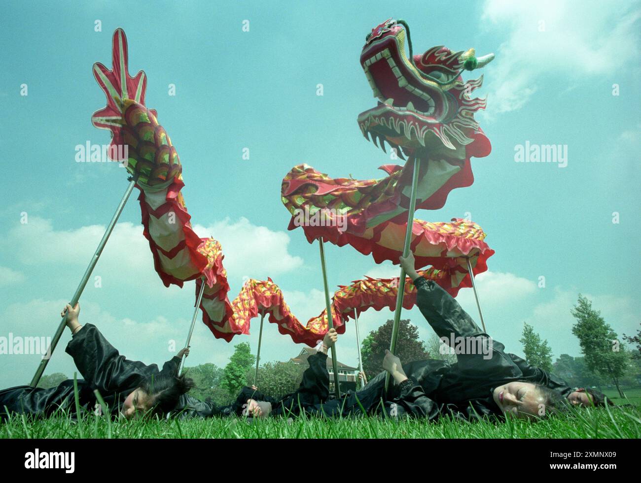 Chinese girl acrobats relax with their Symbolic Totom Dragon in Preston ...
