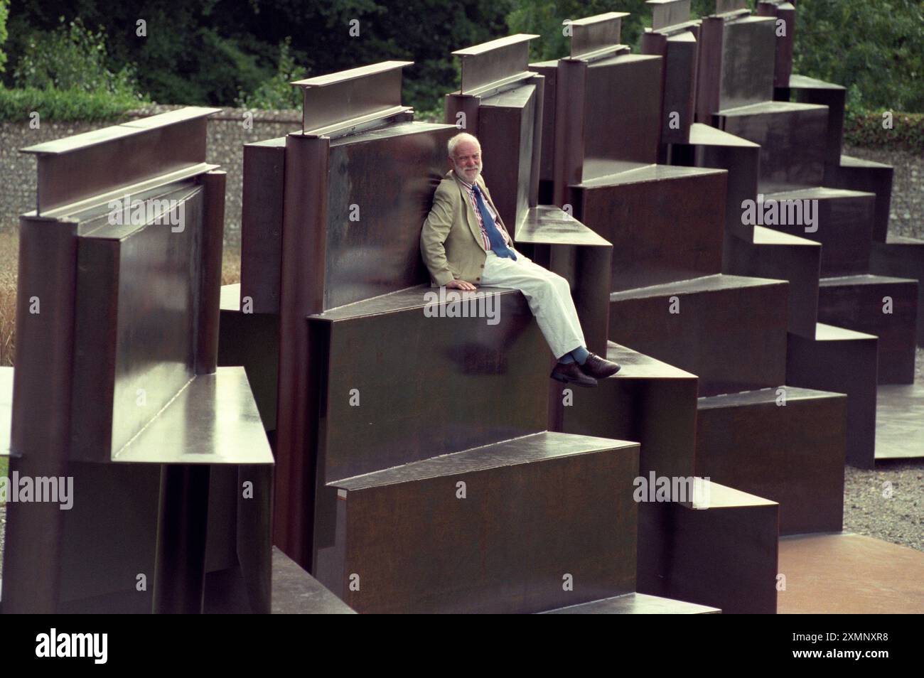 Sculptor Sir Anthony Caro sits on his 120 foot long monolithic creation ...