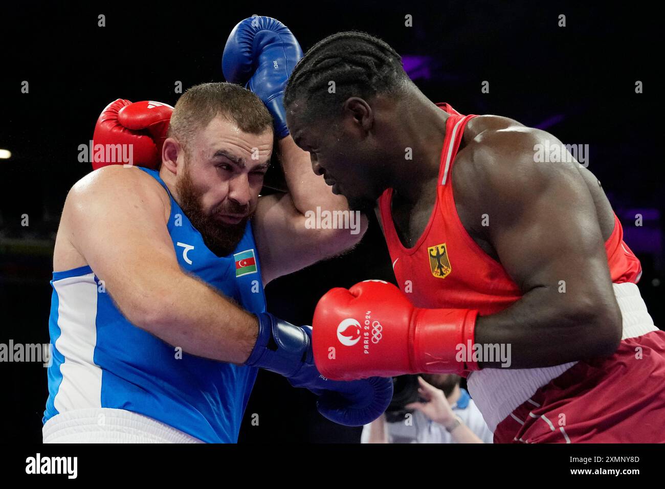 Germany's Nelvie Tiafack hits Azerbaijan's Mahammad Abdullayev in their men's +92 kg preliminary ...