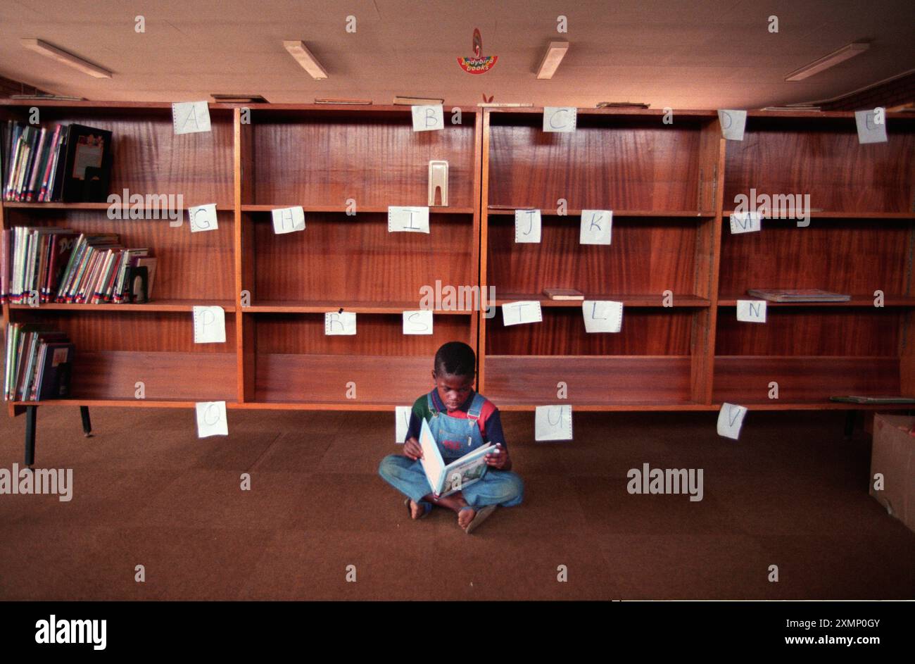 Picture by Roger Bamber : A little boy in front of the almost empty ...