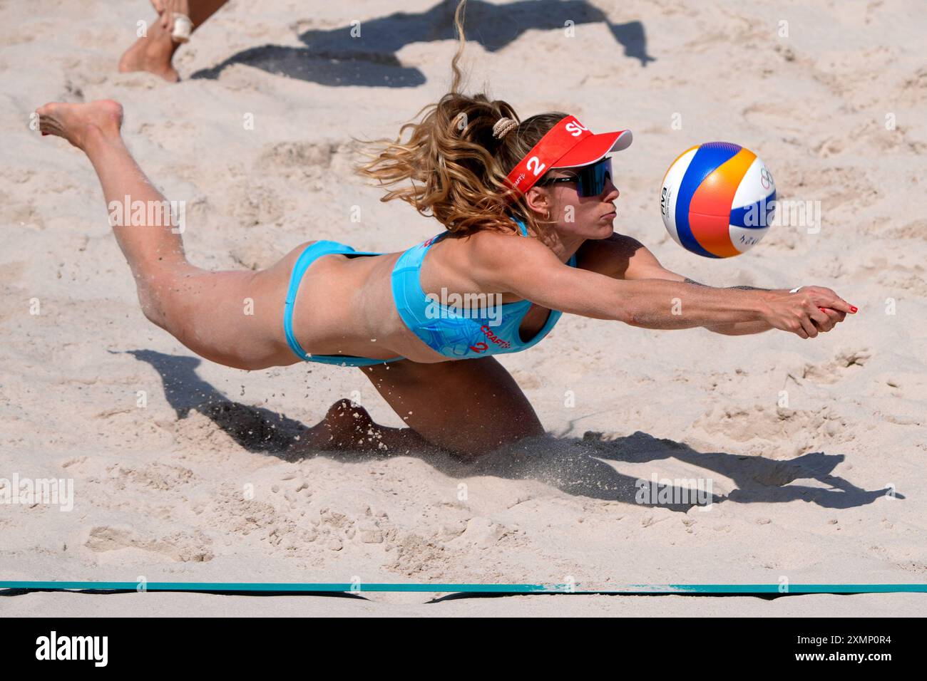 Switzerland's Nina Brunner dives for the ball in a beach volleyball match against Spain at the ...