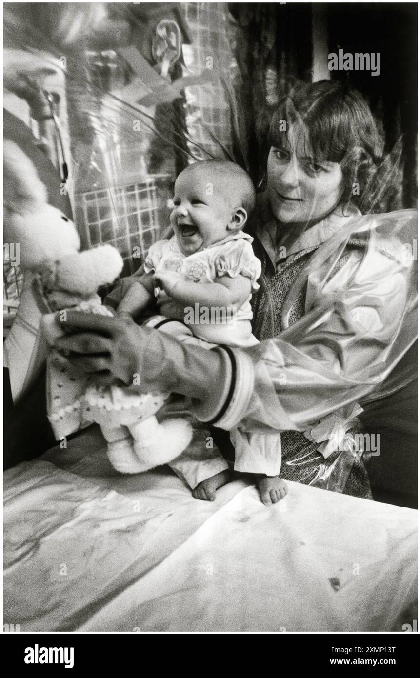 Baby Amanda Norman who could only be cuddled by mother Julie through ...