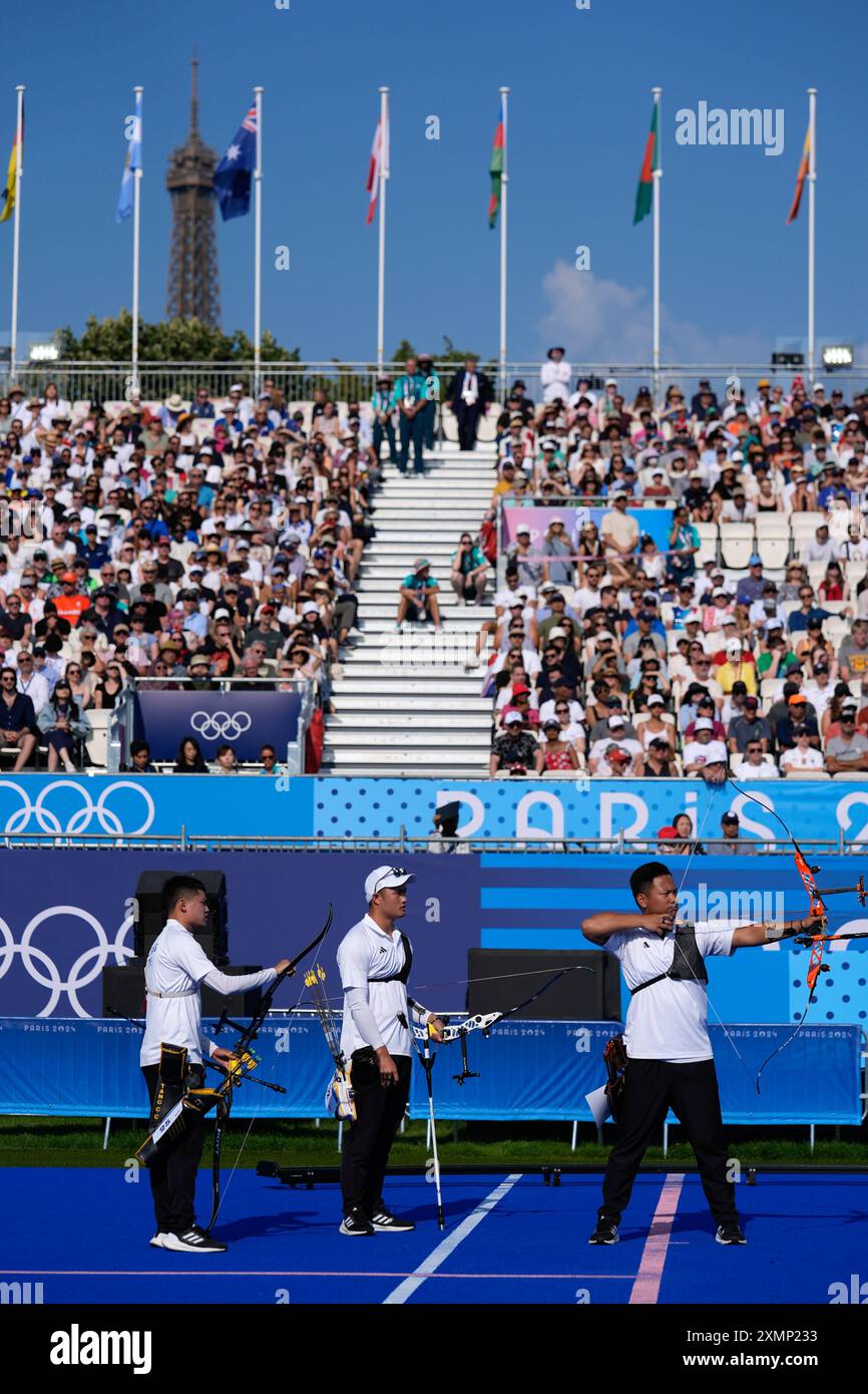 The Eiffel Tower is seen in the background as Taiwan's Tai Yu-Hsuan prepares to shoot and ...