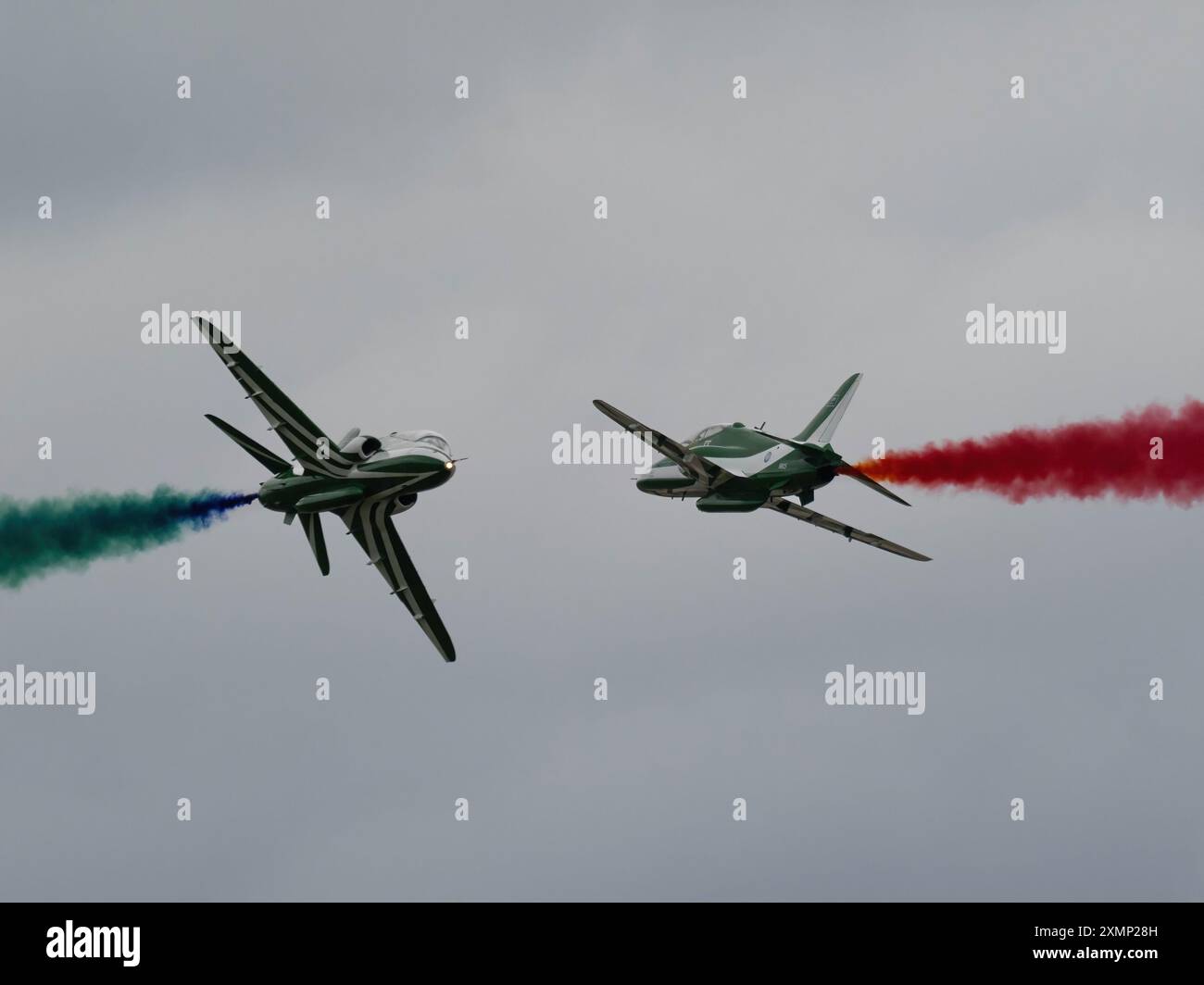 Two aircraft from the Saudi Hawks display team perform a crossing ...