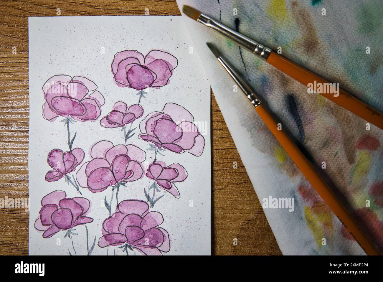 An inviting artist's workspace featuring a vibrant watercolor painting ...