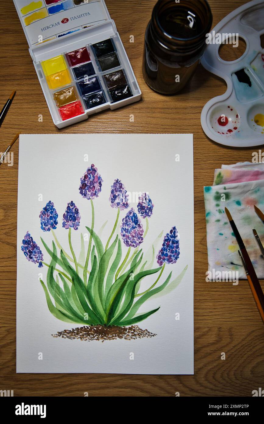 An inviting artist's workspace featuring a vibrant watercolor painting ...