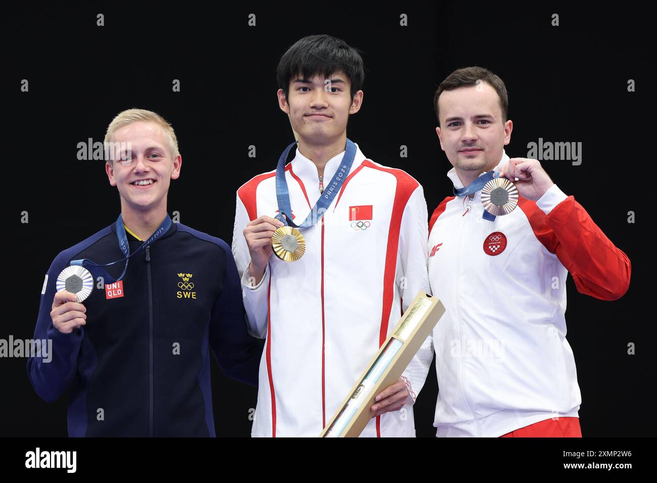 Chateauroux, France. 29th July, 2024. Gold medalist Sheng Lihao (C) of ...