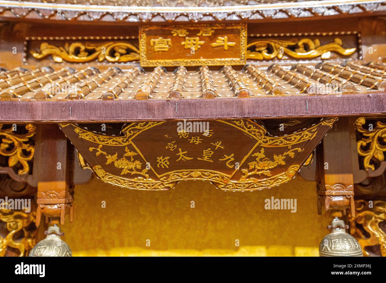 Close up details of the top of palanquin, plaque shows the item belong ...