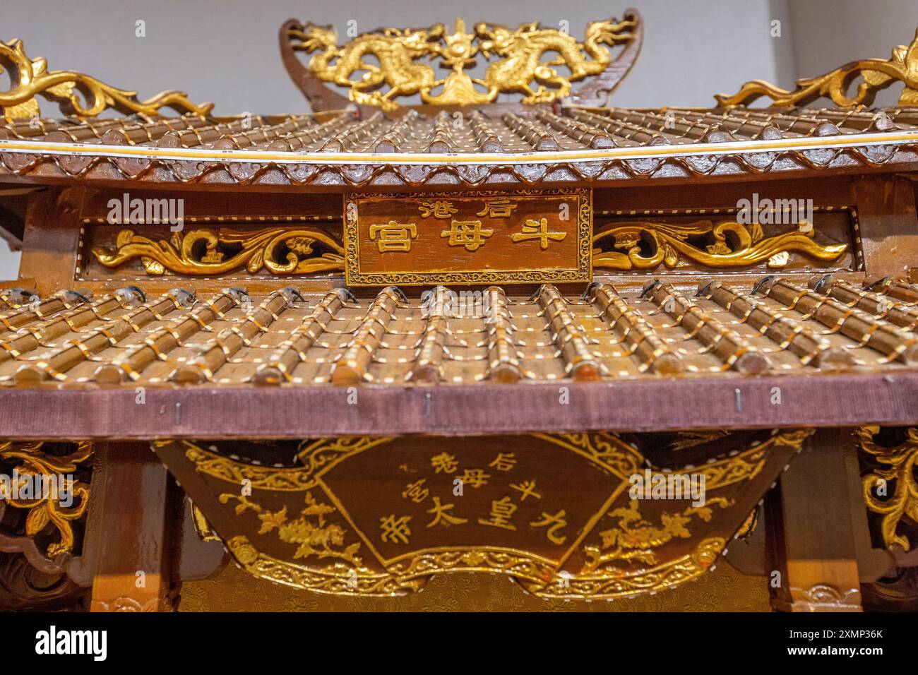 Close up details of the top of palanquin, plaque shows the item belong ...