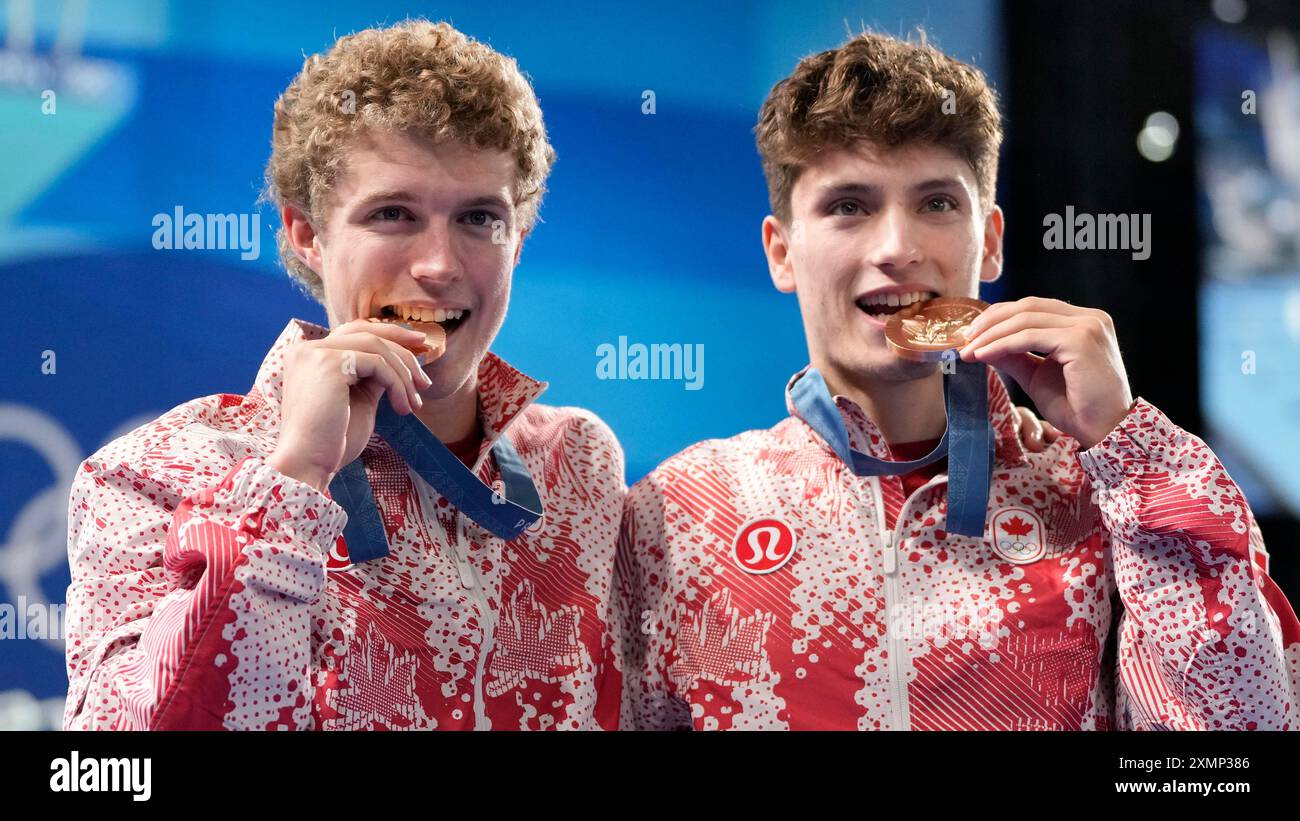 Canada's Rylan Wiens and Nathan Zsombor-Murray celebrate on the podium ...