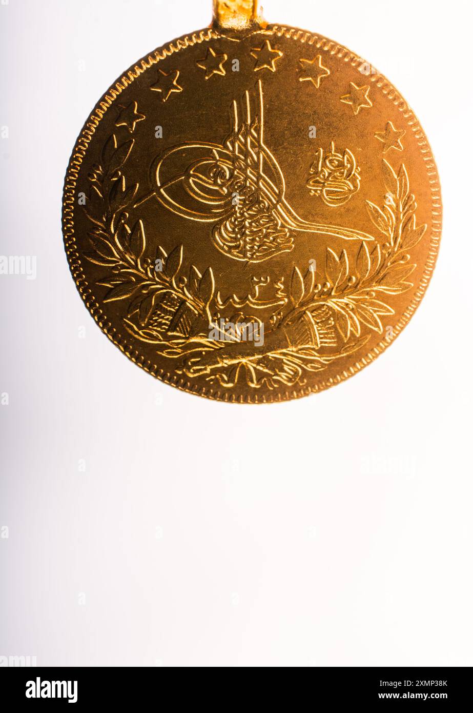 Turkish Ottoman style gold coin on white background Stock Photo - Alamy