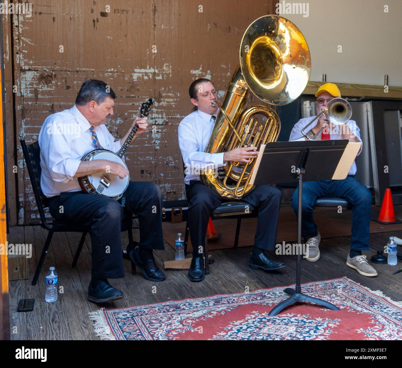 Three piece band at a street fair in Greenport, NY Stock Photo - Alamy