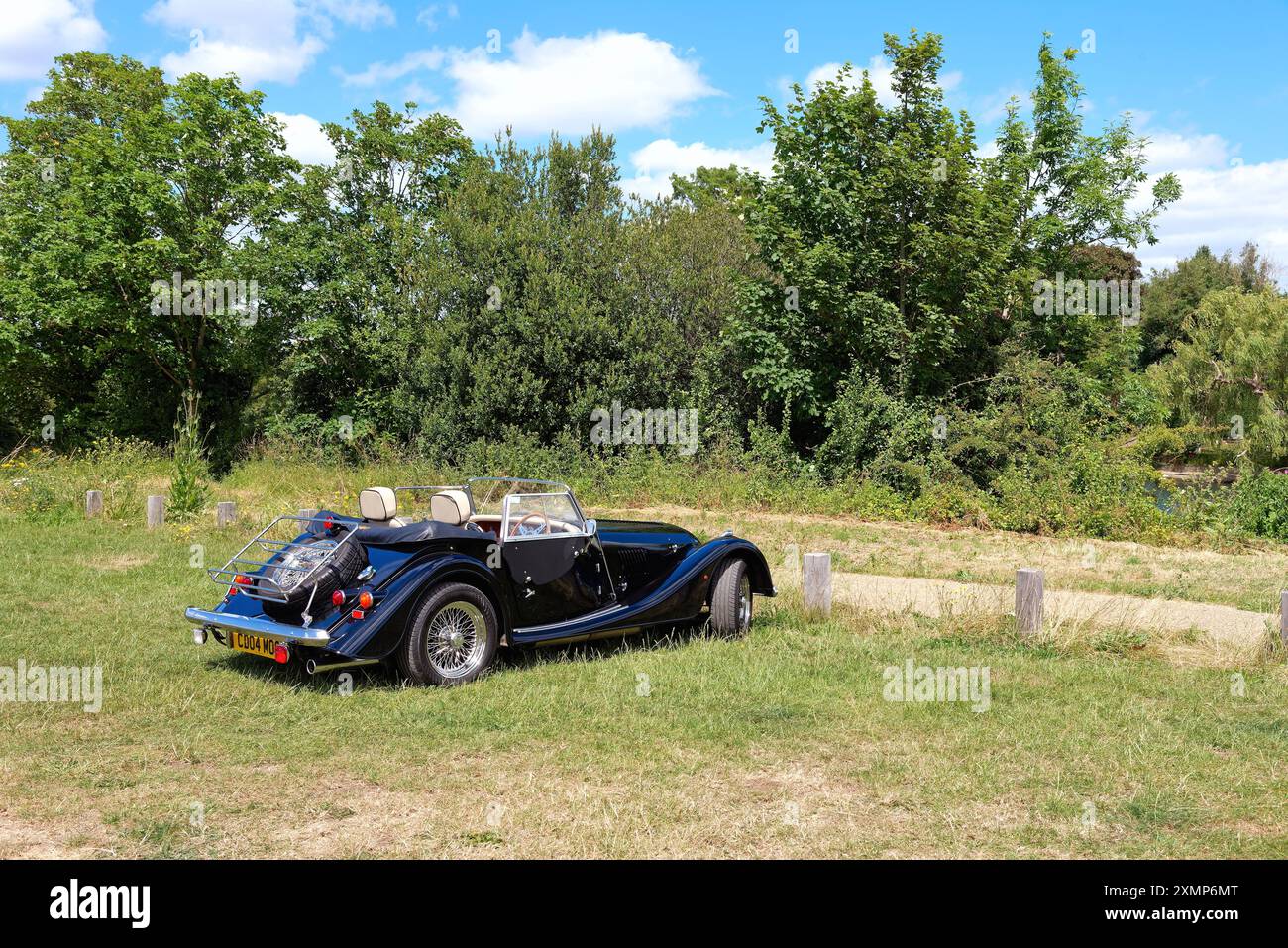 A black Morgan 4/4 open top sports car parked in countryside at ...