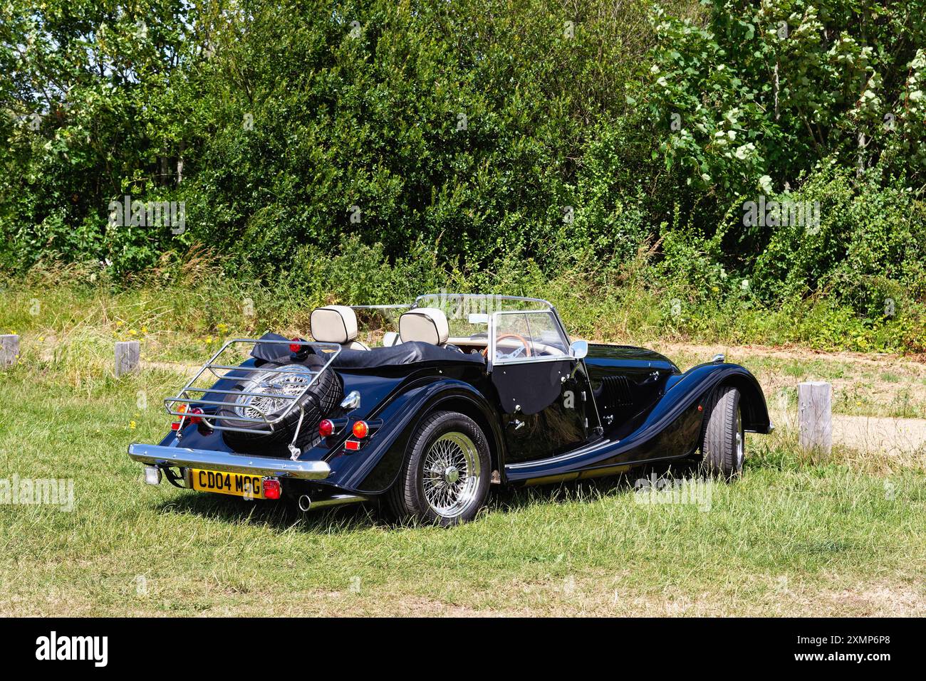 A black Morgan 4/4 open top sports car parked in countryside at ...