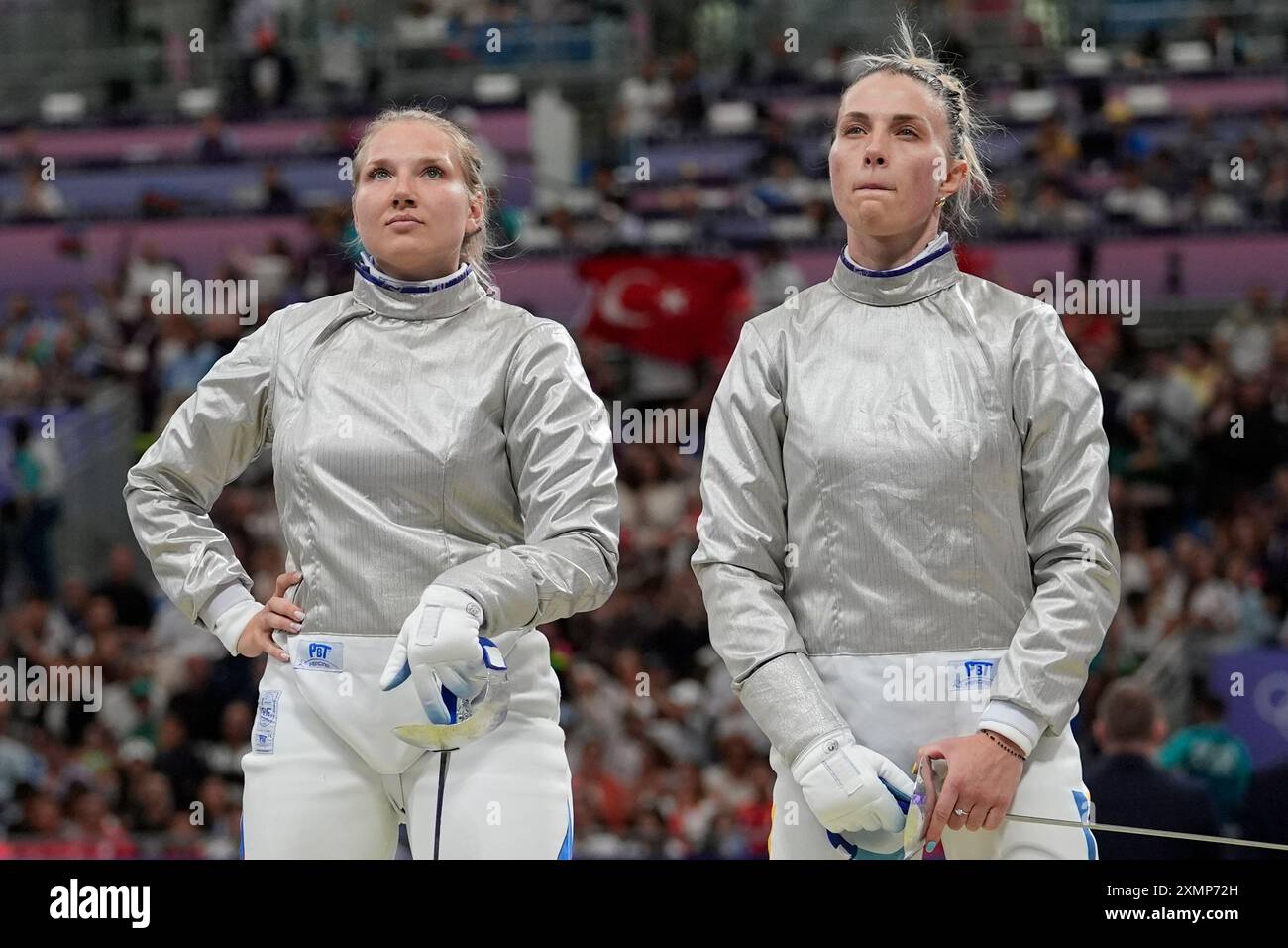Ukraine's Olga Kharlan, right, and Azerbaijan's Anna Bashta stands ...
