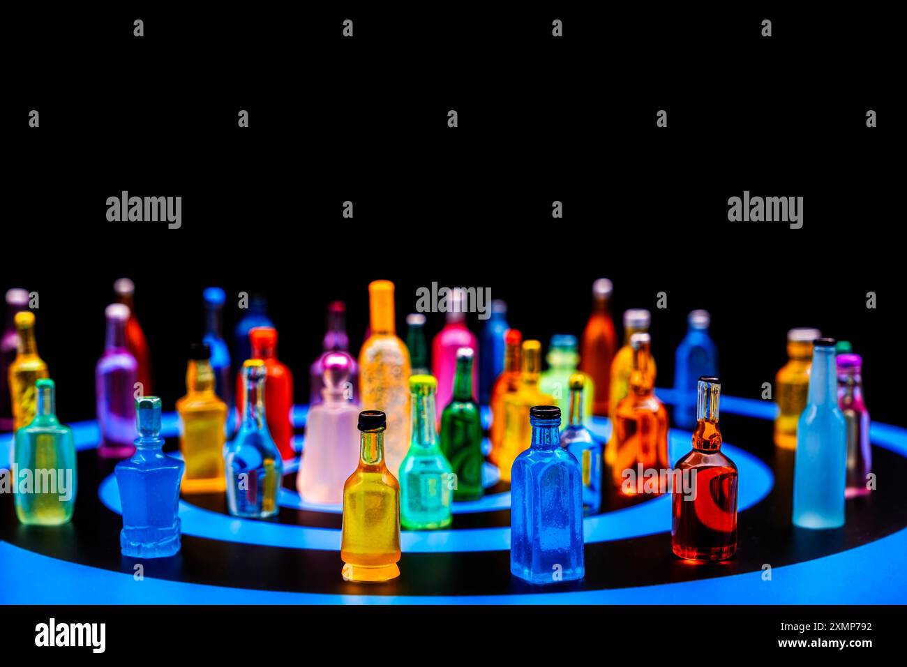 various miniature bottles of alcohol without labels on table with ...