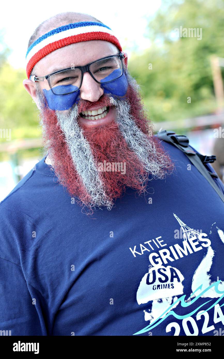 A Team USA fan with his beard painted in red, white and blue enters the ...