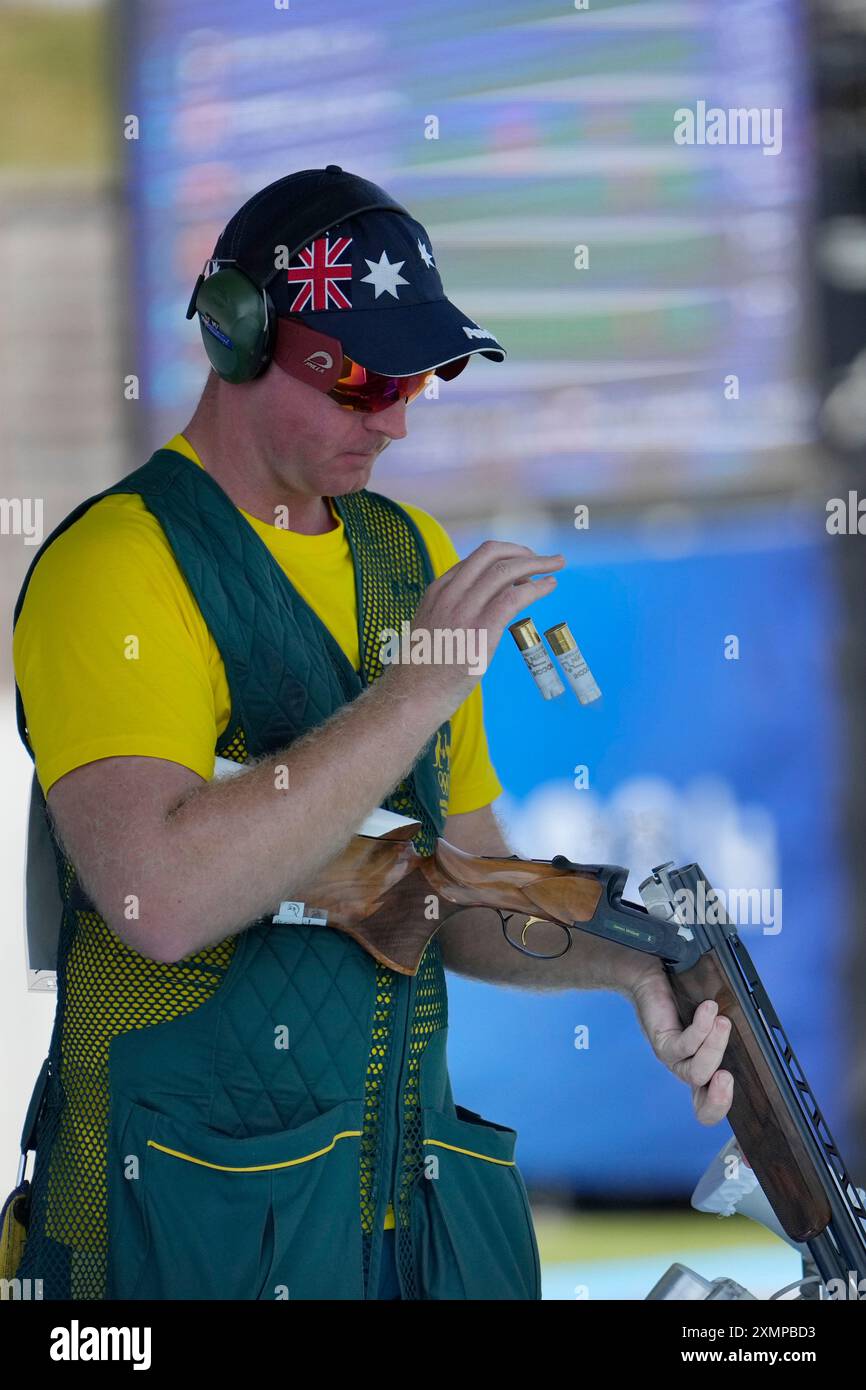 Australia's James Gillett ejects empty cartridges after the shot during Trap Men qualification ...