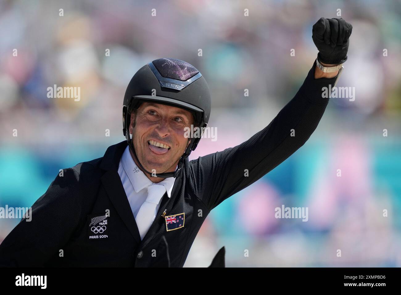 New Zealand's Tim Price, riding Falco, gestures, during the equestrian ...