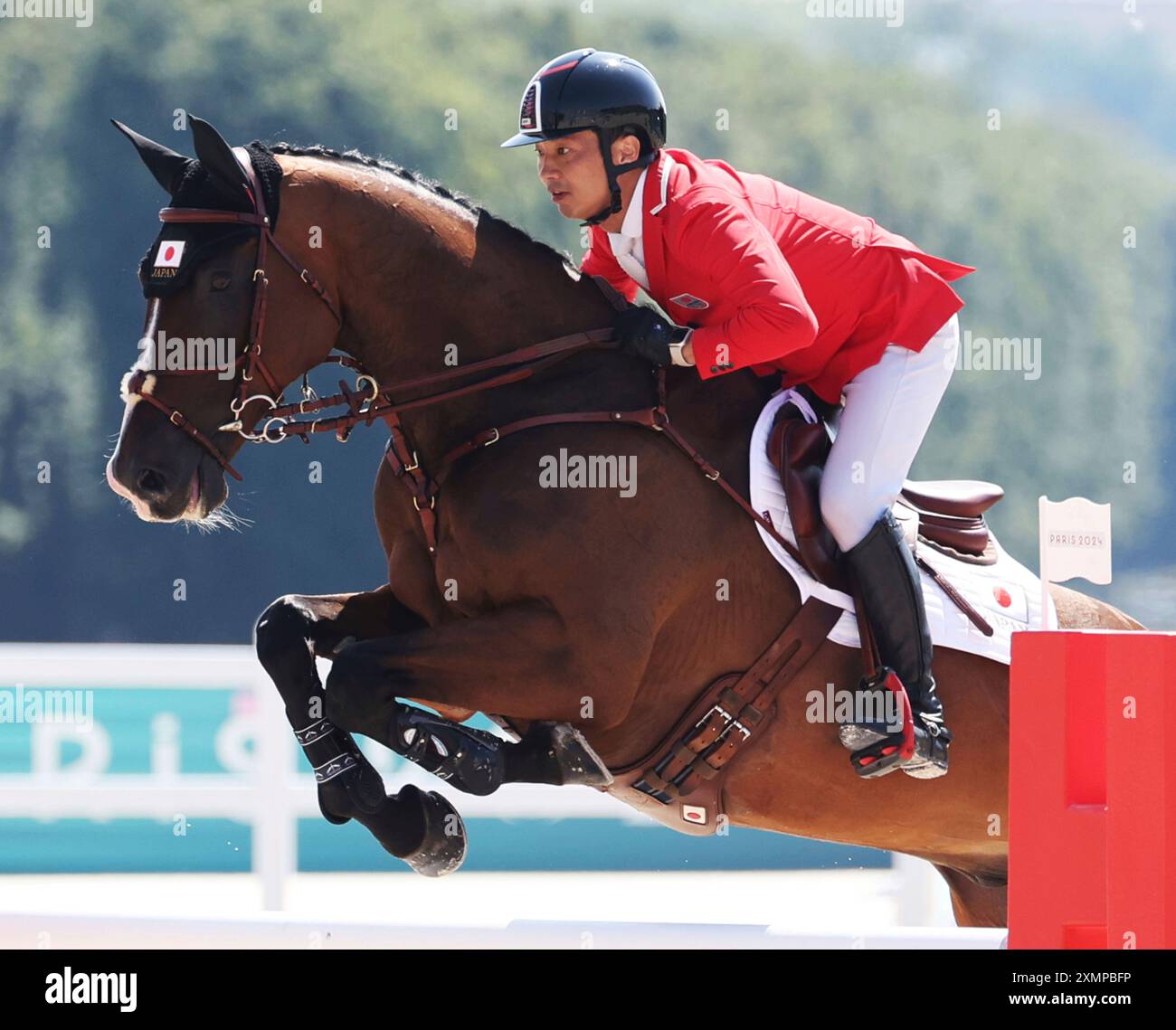 Toshiyuki Tanaka of Japan performs during Equestrian Eventing Jumping ...