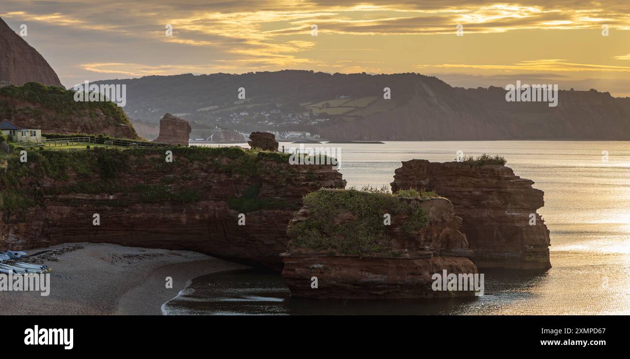 Sandstone sea stacks at Ladram Bay in Devon, with Sidmouth in the ...