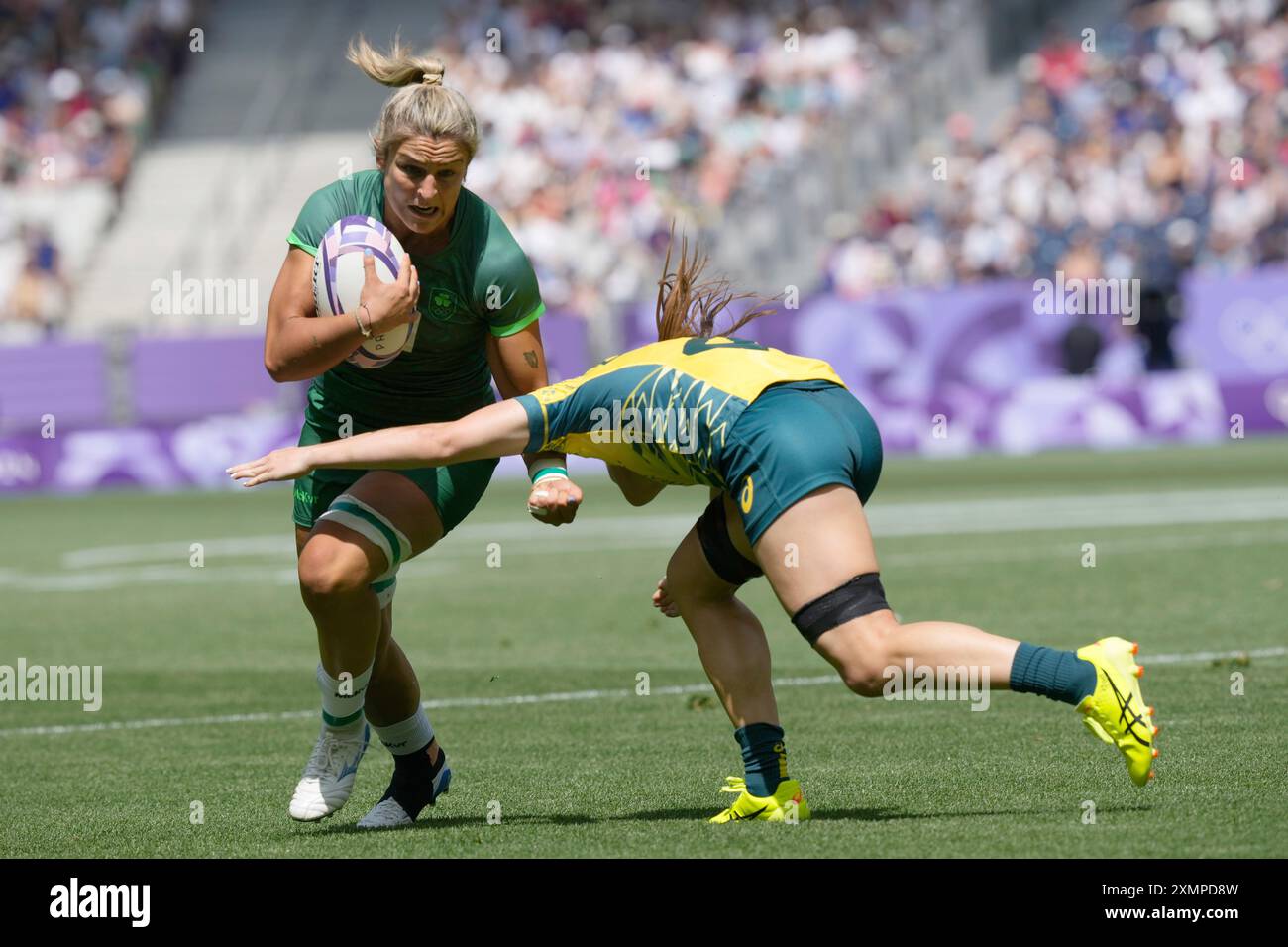 Ireland's Erin King left, is tackled by Australia's Dominique du Toit ...