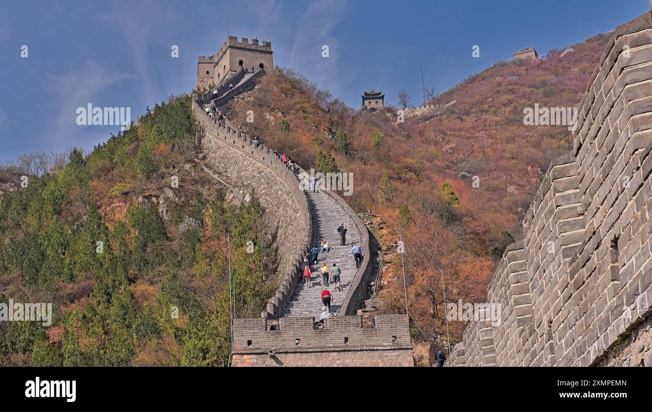 Beijing, Vhina -- April 5, 2016. Tourists trudge up a path to a ...