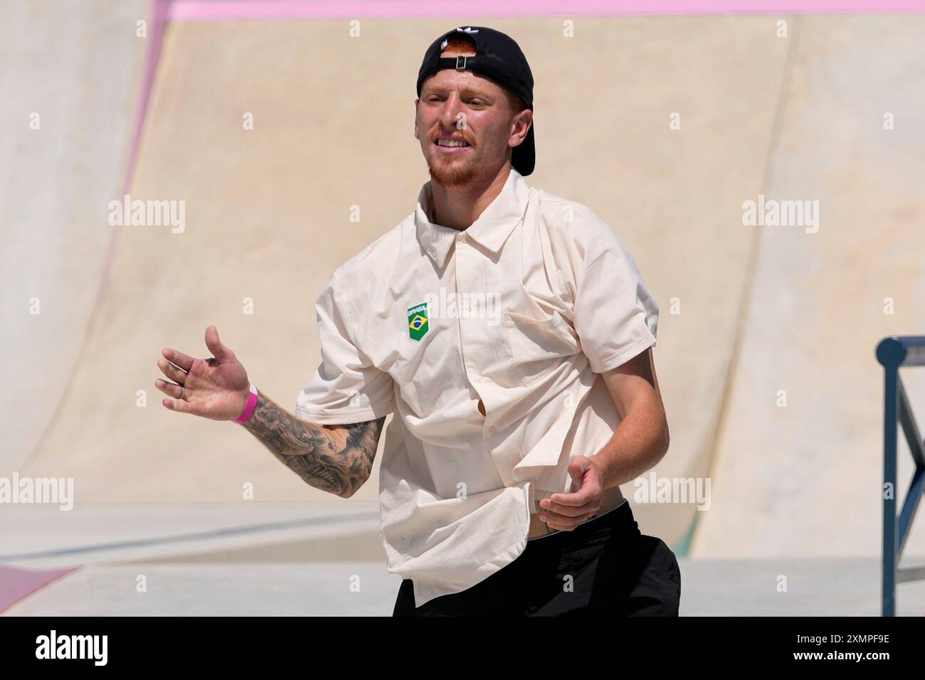 Giovanni Vianna, of Brazil, reacts during the men's skateboard street ...
