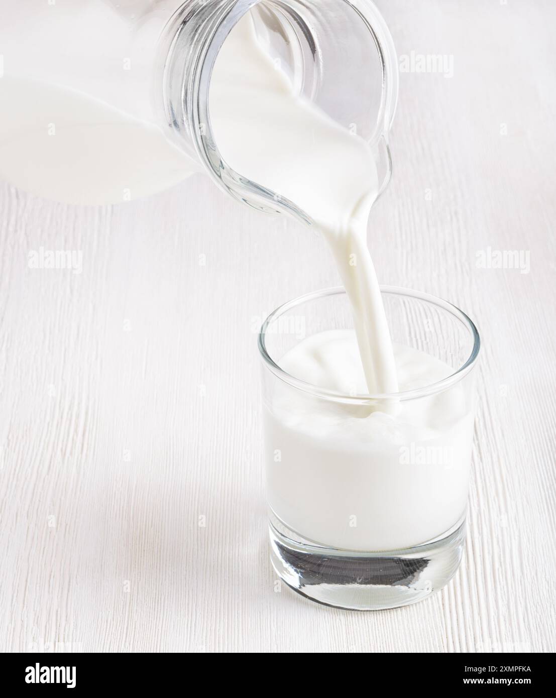 Milk pouring into pitcher hi-res stock photography and images - Alamy