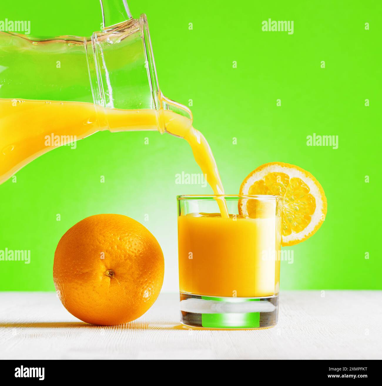 Juice pouring from pitcher to glass hi-res stock photography and images - Alamy