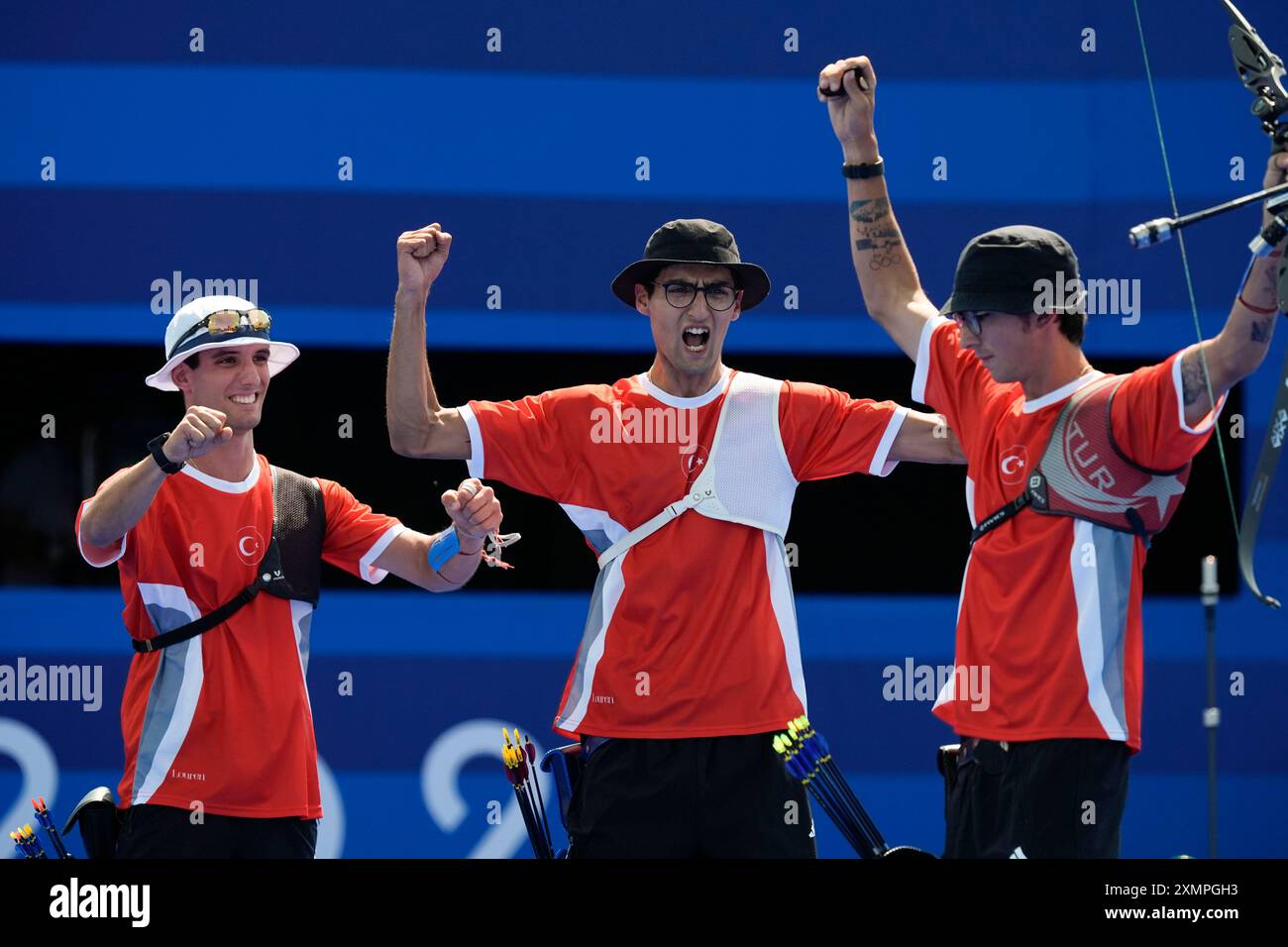 Turkey's Mete Gazoz, right, Berkim Tumer, left, and Turkey's Abdullah ...