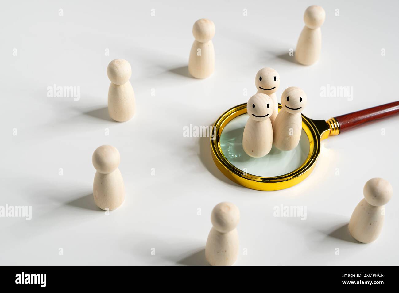 Recruitment and job search magnifying glass with wooden people concept ...