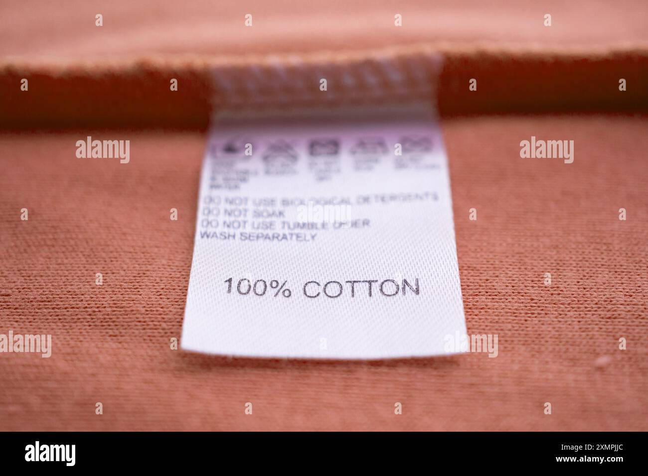 White laundry care washing instructions clothes label on cotton shirt ...