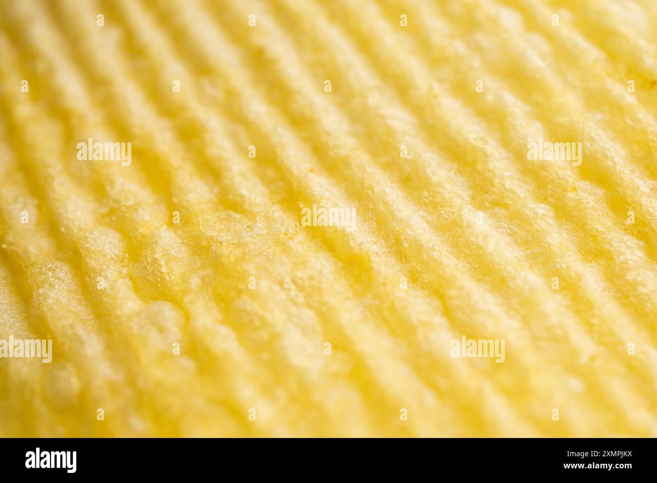 Potato chip pattern texture background closeup Stock Photo - Alamy