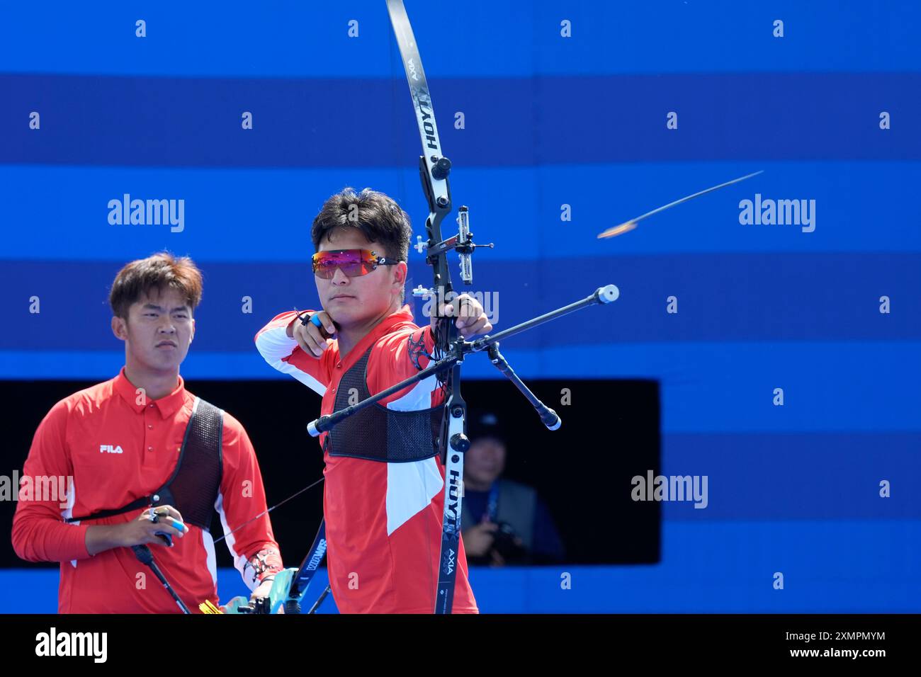 China's Wang Yan shoots during the men's team semifinals Archery ...