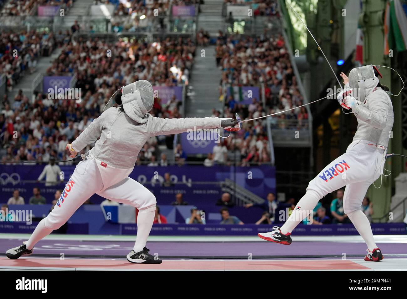 South Korea's Choi Sebin, left, competes with South Korea's Jeon ...