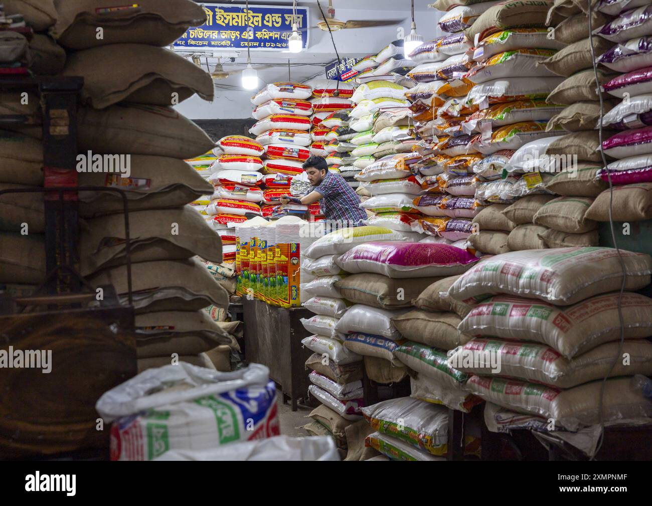 Bangladeshi man selling rice bags at Kawran bazar, Dhaka Division ...