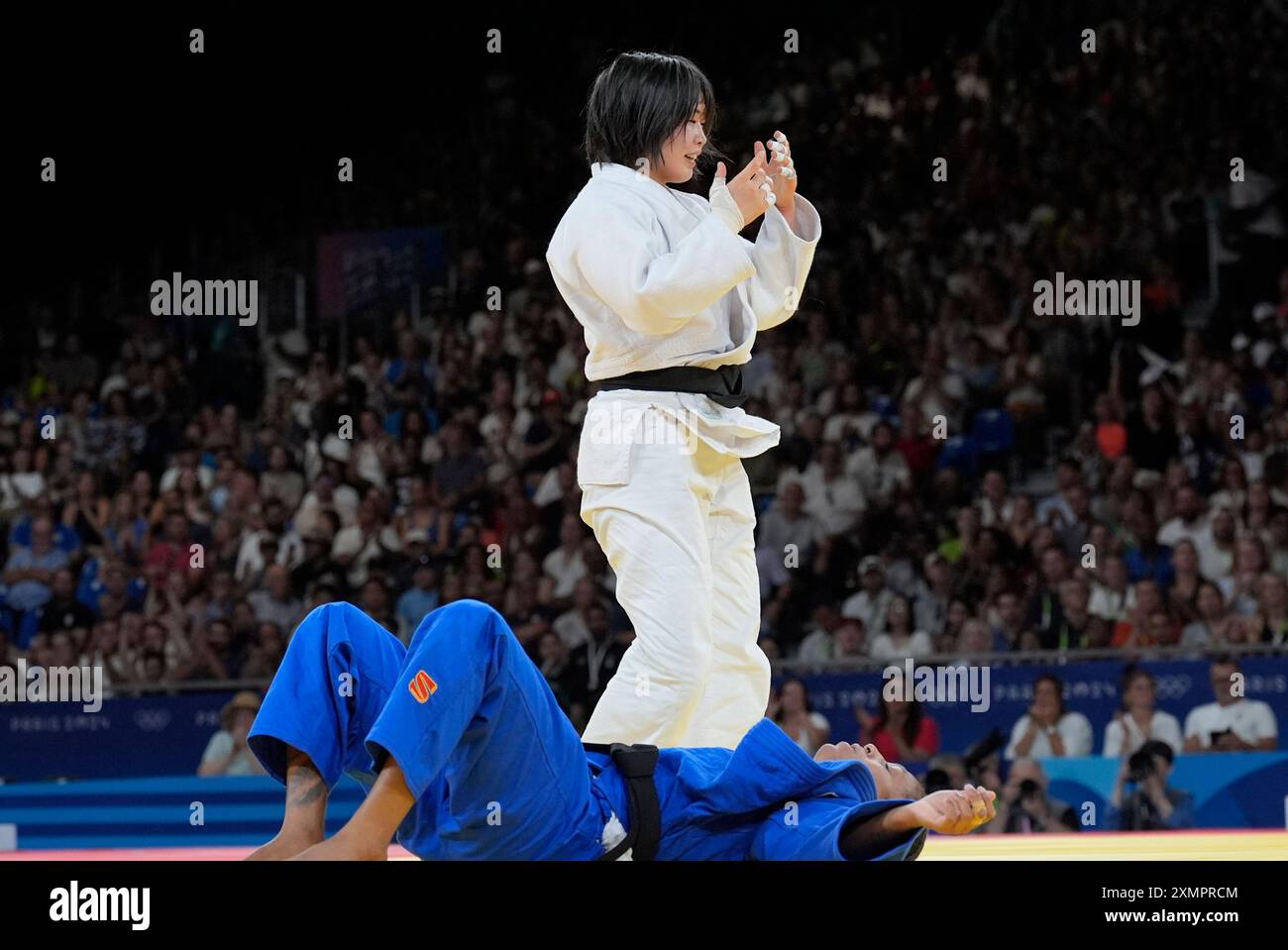 South Korea's Mimi Huh celebrates after defeating Brazil's Rafaela ...