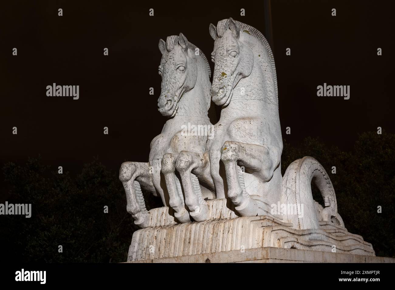 Statue of mythical Hippocampus at night in Empire Square Garden, Lisbon ...