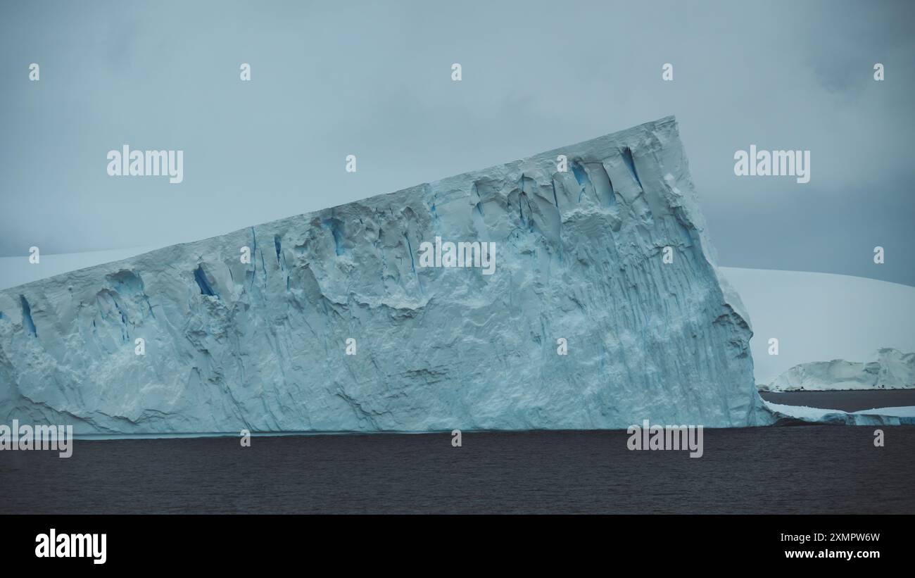 Beautiful Nature Scenery Iceberg Antarctica. Cloudy Sky Steep Angled ...