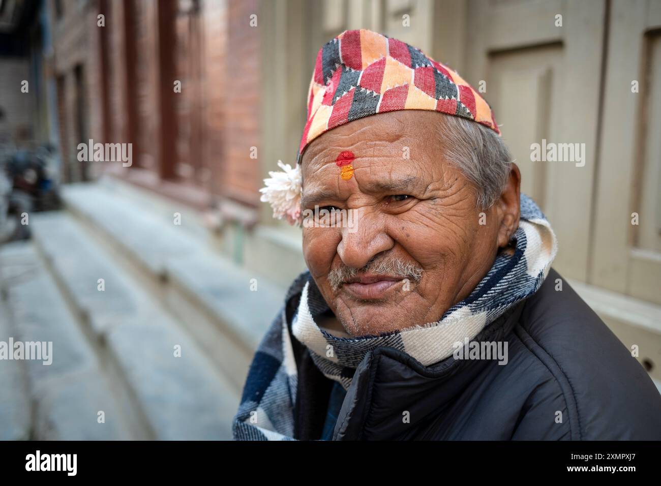 Nepalese gentleman wearing traditional dhaka topi cap or hat in streets ...