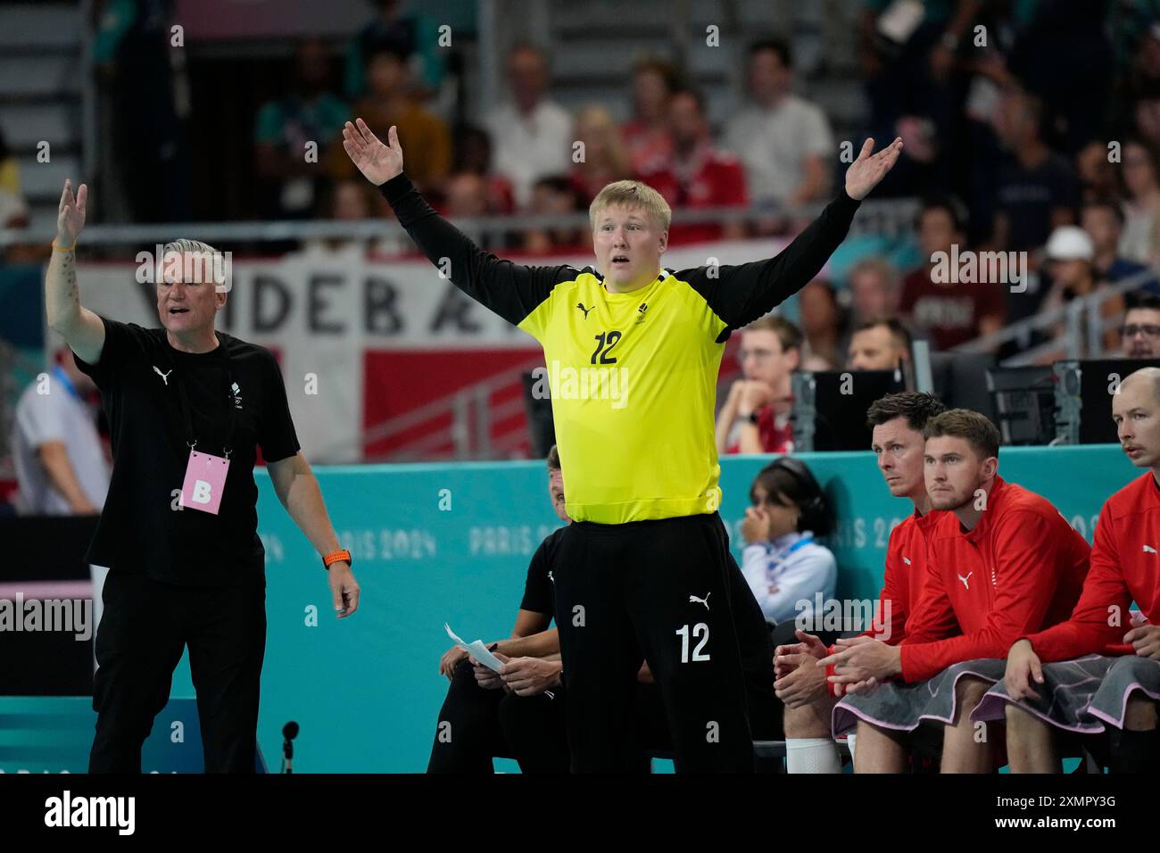 Emil Nielsen, of Denmark, center, gestures and shouts from the ...