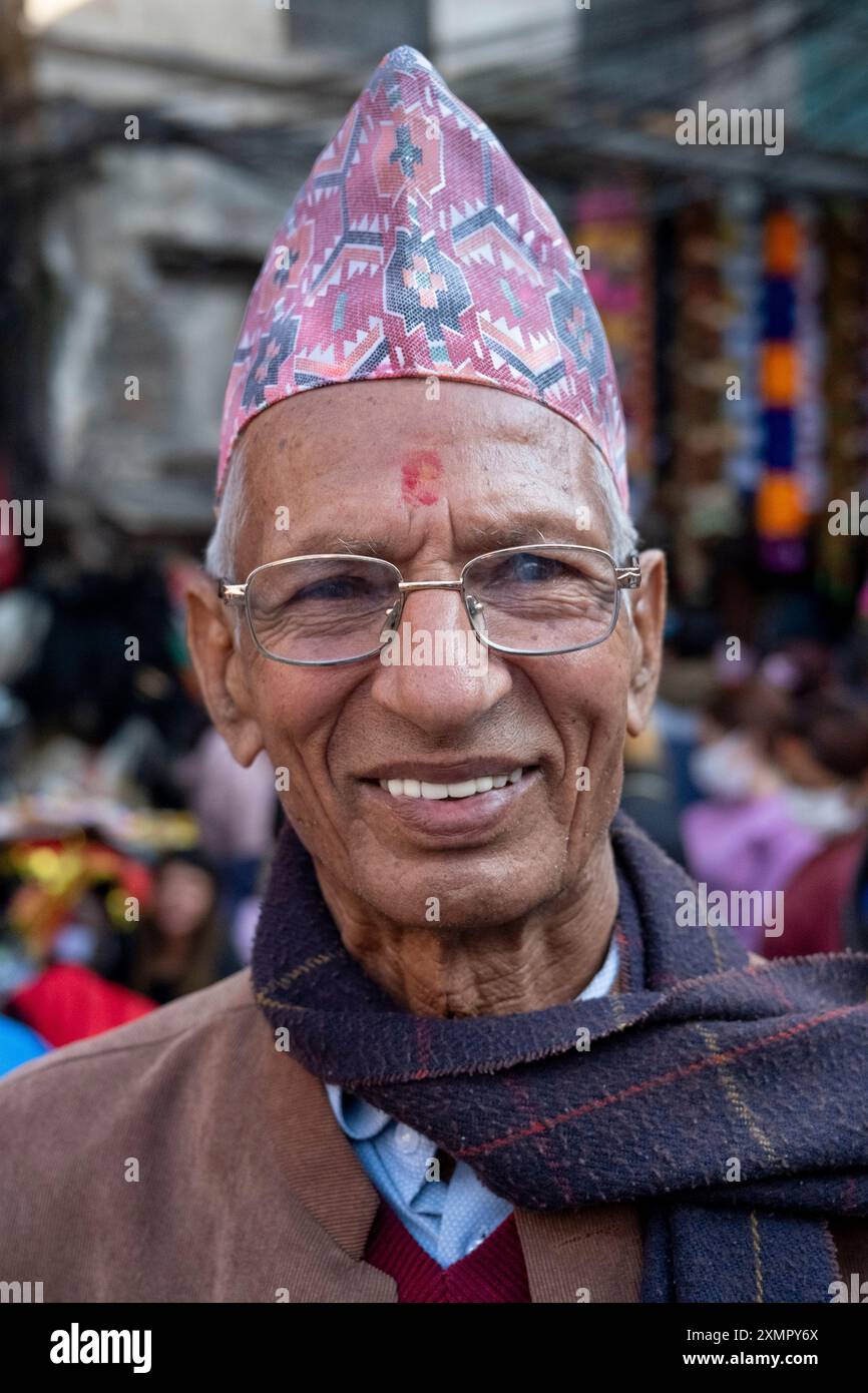 Nepalese gentleman wearing traditional dhaka topi cap or hat in streets ...