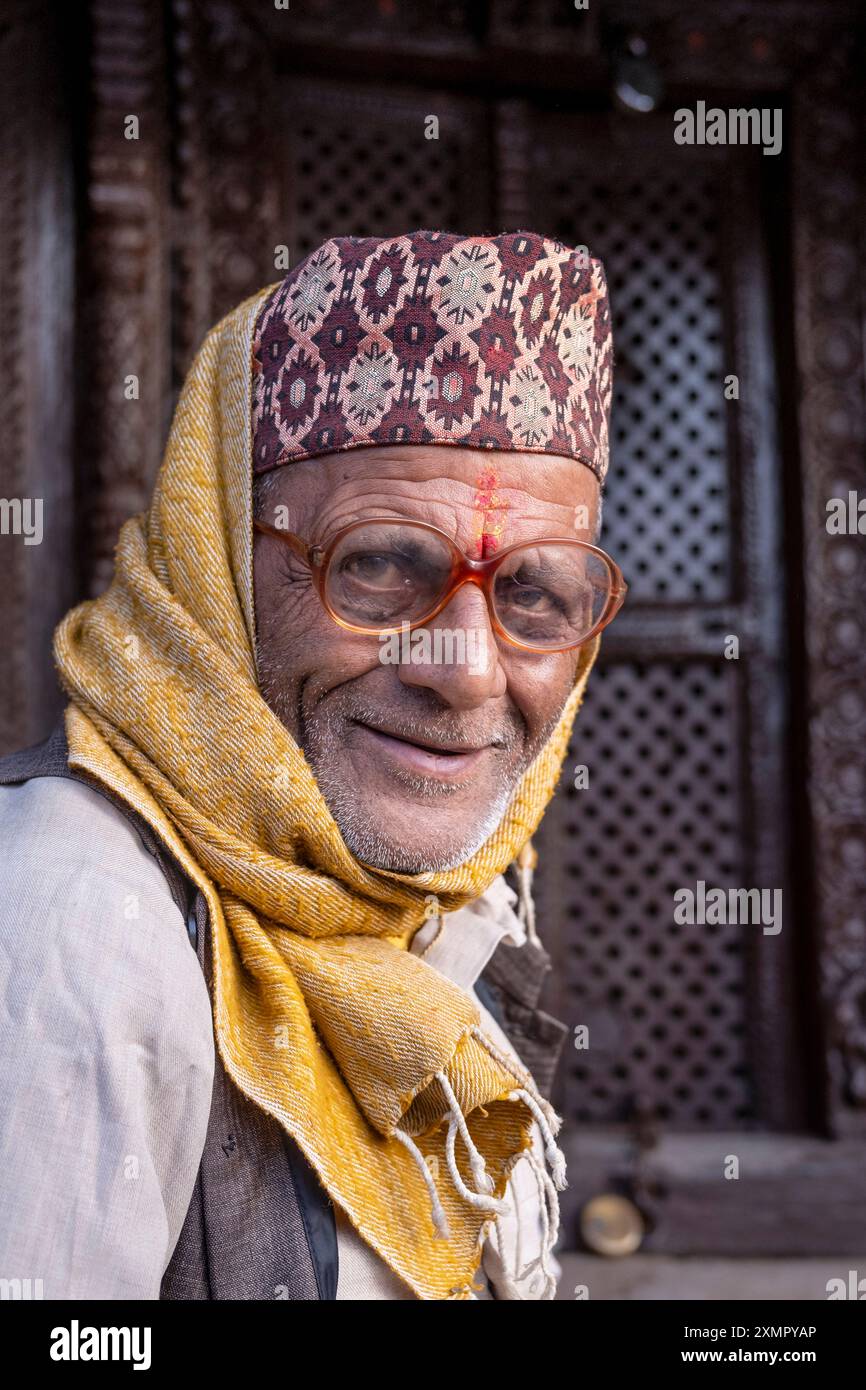 Nepalese gentleman wearing traditional dhaka topi cap or hat in streets ...