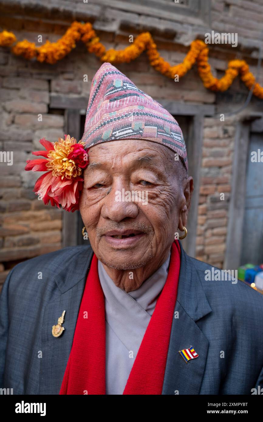 Nepalese gentleman wearing traditional dhaka topi cap outside home ...