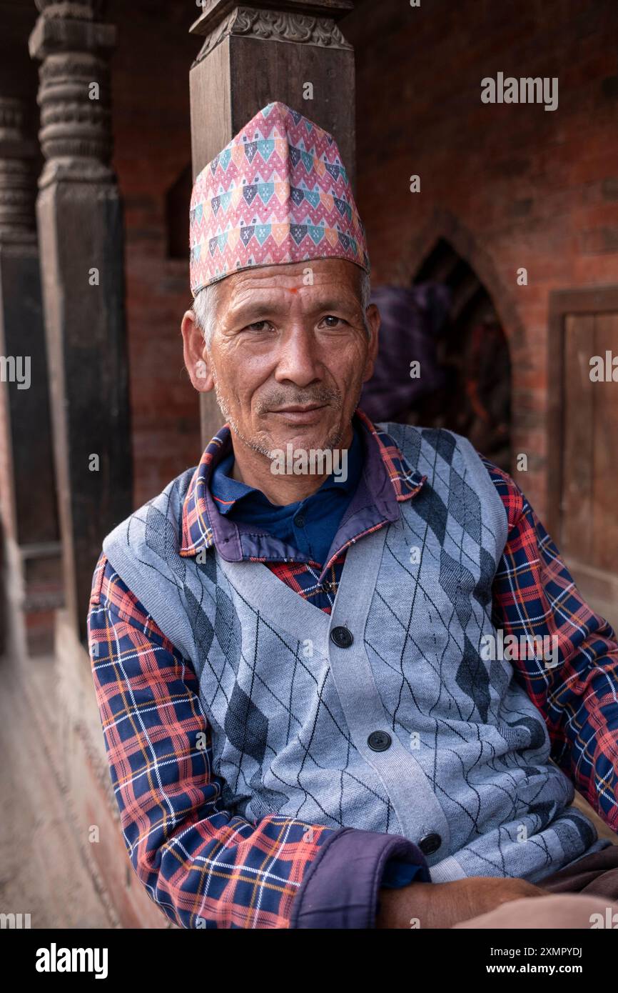 Nepalese gentleman wearing traditional dhaka topi cap or hat in streets ...