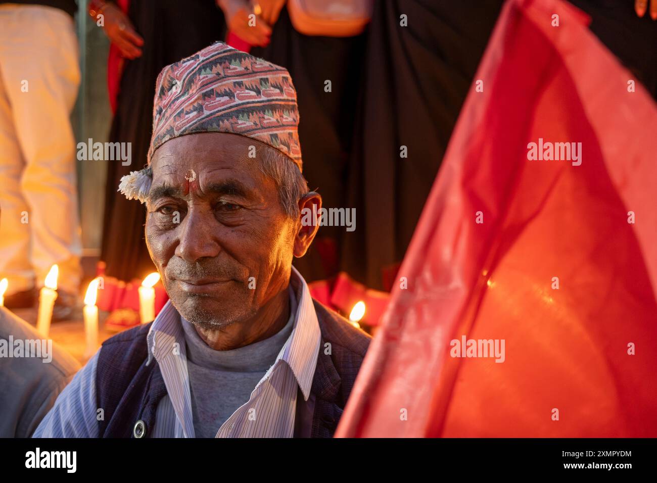 Nepalese gentleman wearing traditional dhaka topi cap at night during ...